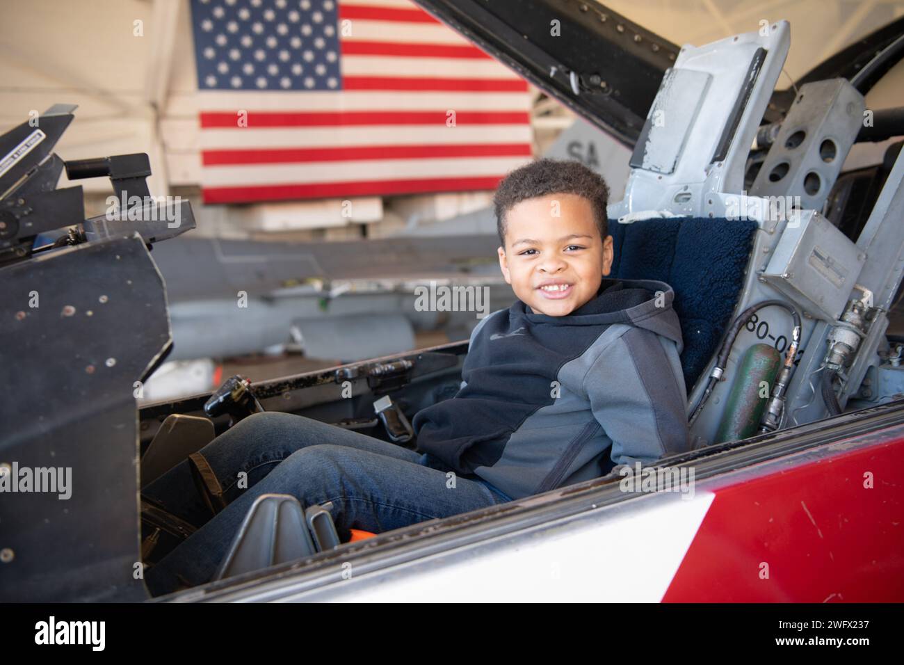 Pilot for a Day, Carter Winters poses for a photo in the cockpit of an ...
