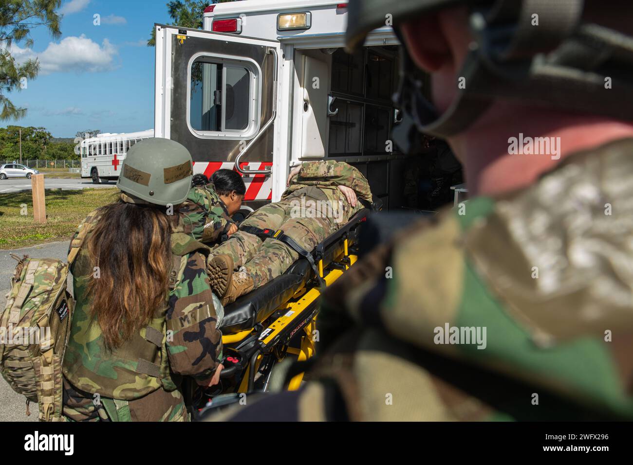 U.S. Air Force Airmen assigned to the 18th Medical Group load a ...