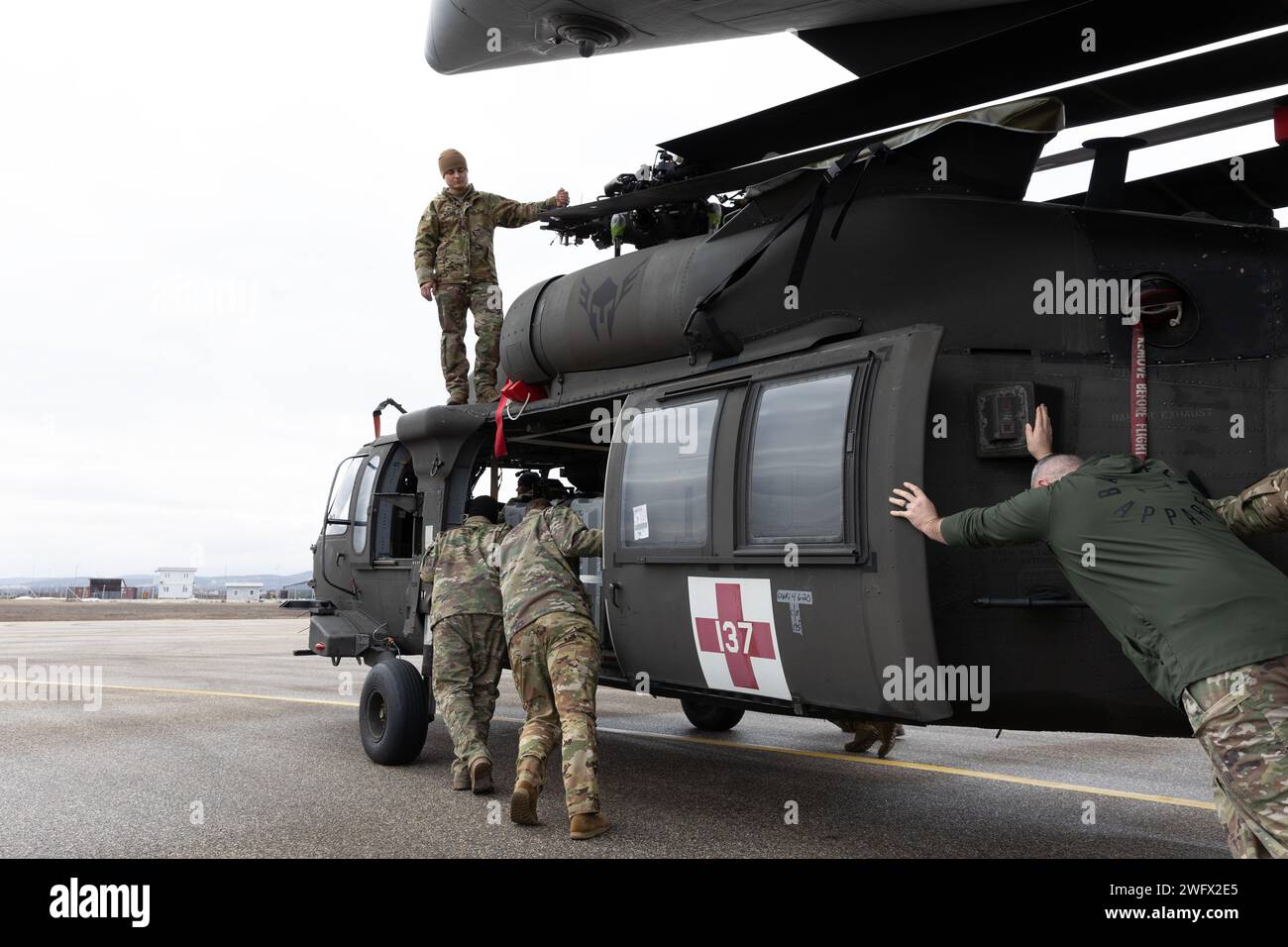 Members of 1st Battalion, 126th Aviation Regiment retrograde nine UH-60 ...