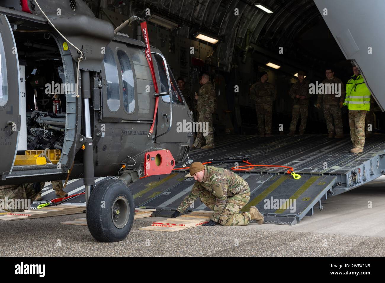 Members of 1st Battalion, 126th Aviation Regiment retrograde nine UH-60 ...