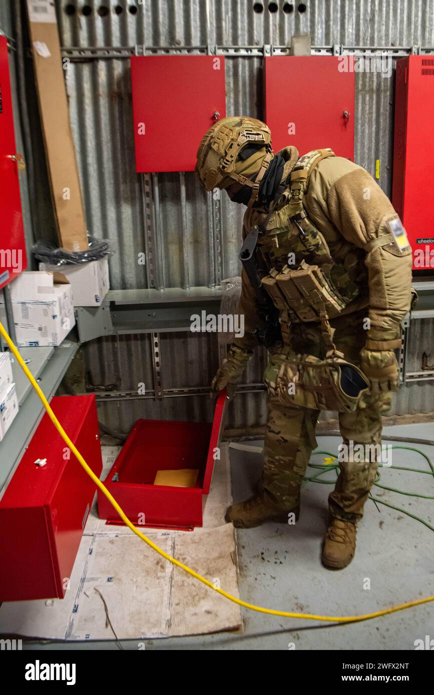 A defender from the 5th security Forces Squadron performs a security ...