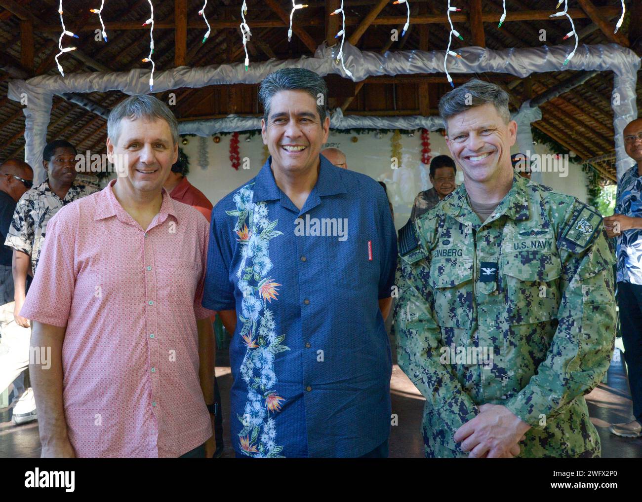 From right to left, U.S. Navy Capt. Jeffrey Feinberg, commanding ...