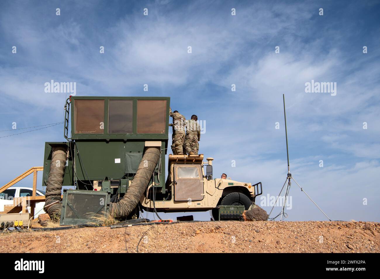 The 409th Air Expeditionary Group radar, airfield and weather systems team replaces windows in ...