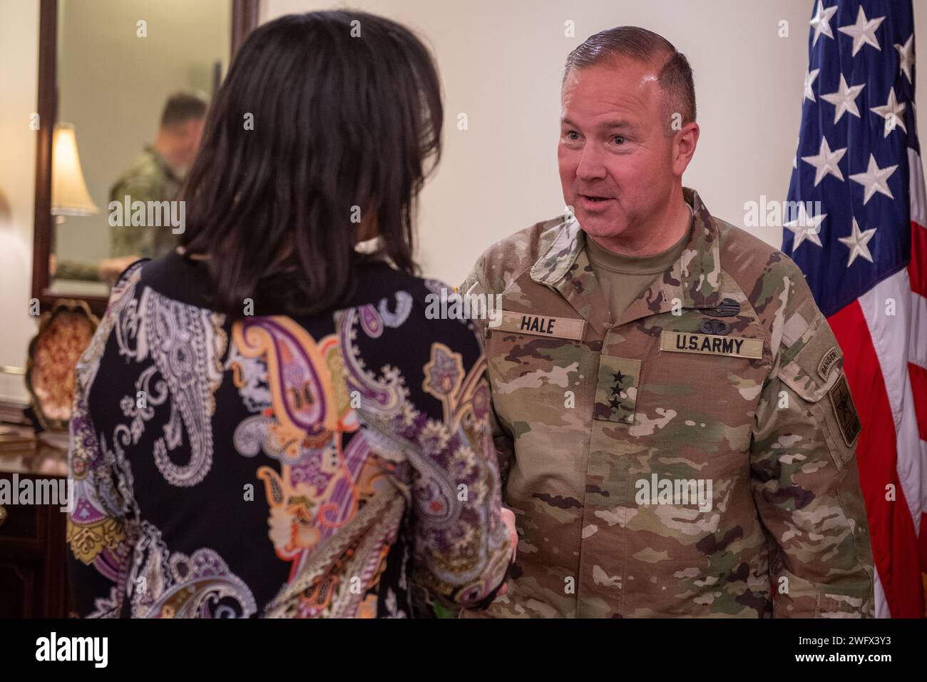 A guest congratulates U.S. Army Lt. Gen. Anthony R. Hale, right, the ...
