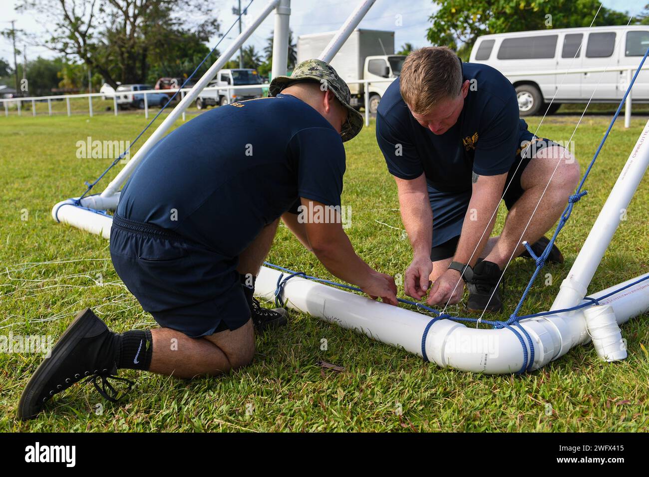 U.S. Navy Chief Equipment Operator Christian Ransomer, right, from ...