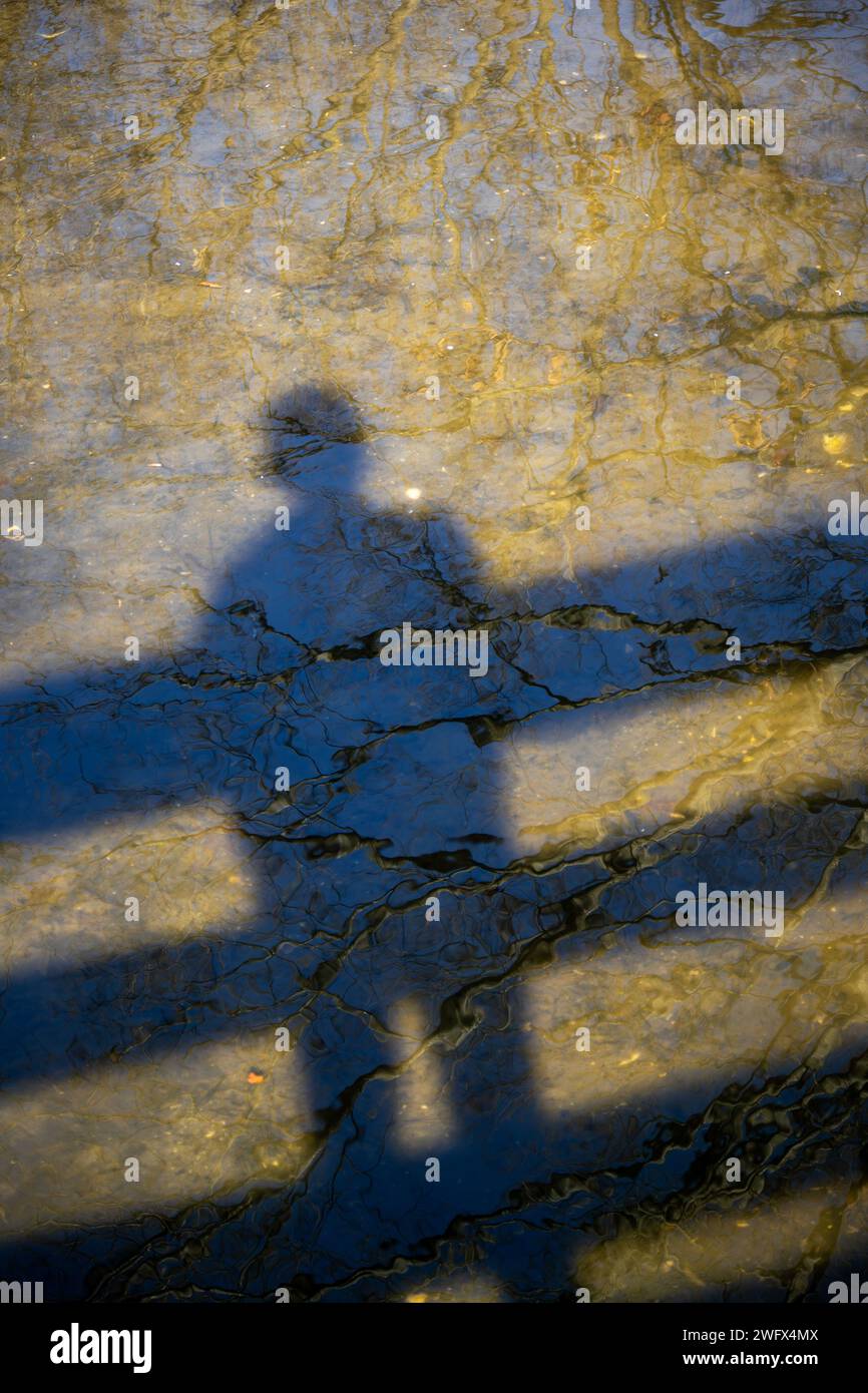 Silhouette Shadow Person Standing on Bridge Over Creek Stock Photo - Alamy