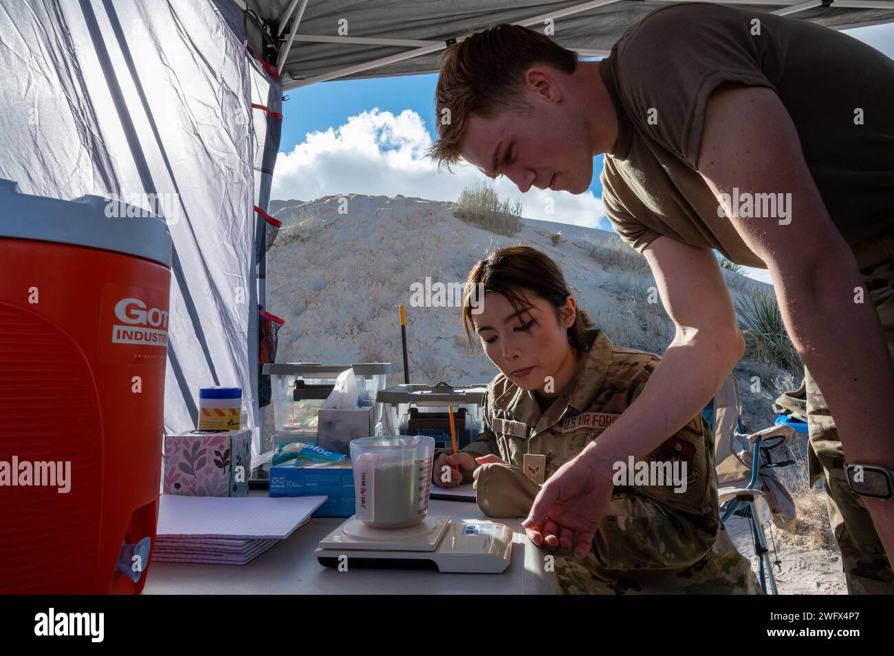 U.S. Air Force Airmen 1st Class Adam Sapp and Kiandra Mandal, 54th Operations Support Squadron ...