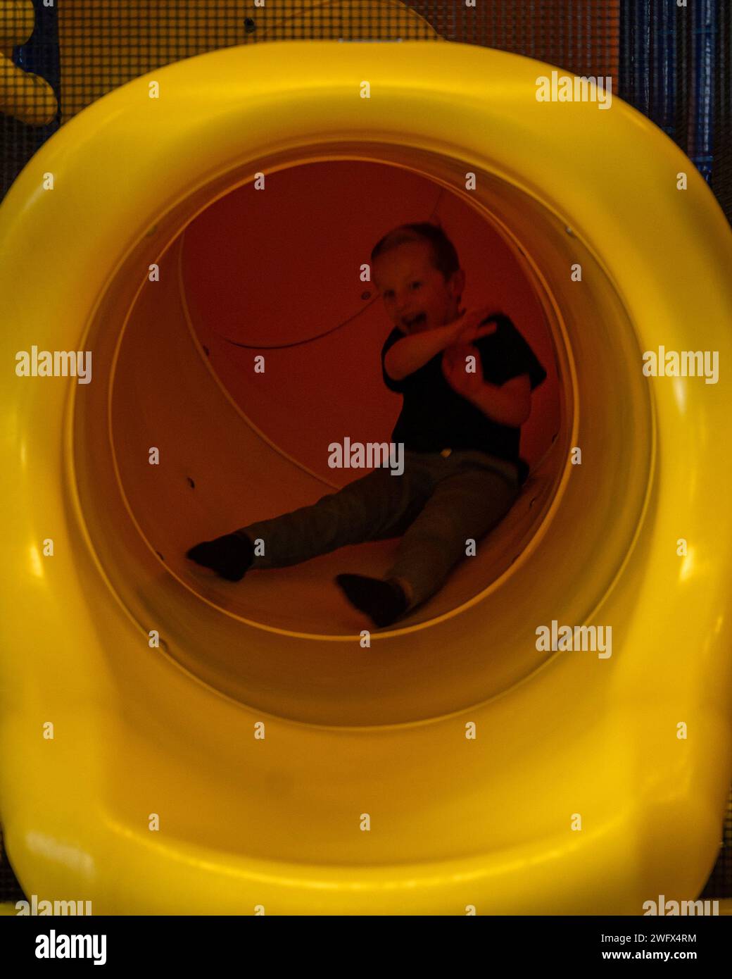 A child goes down the slide at the new indoor playground in the Losano ...