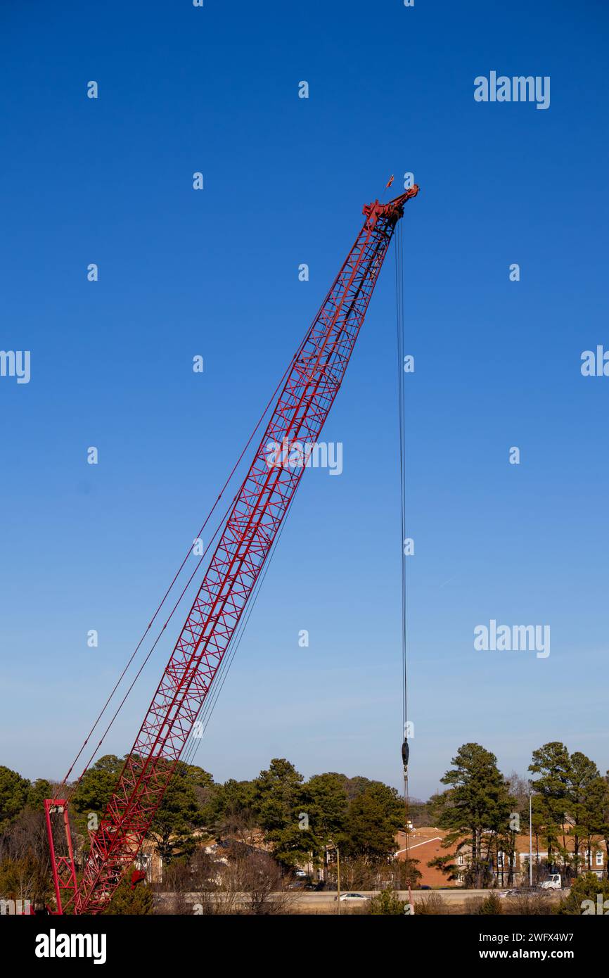 Red Construction Crane Over Suburban Road Stock Photo - Alamy