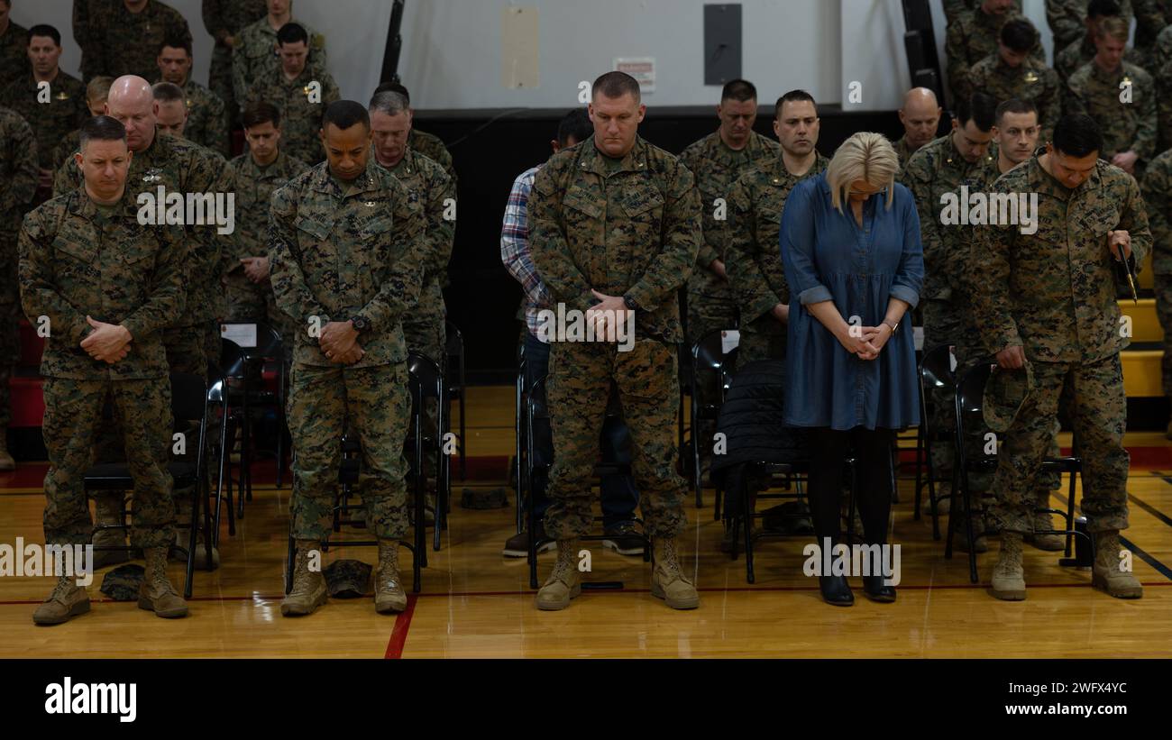 U.S. Marine Corps leaders of 2d Marine Division and civilian guests bow ...