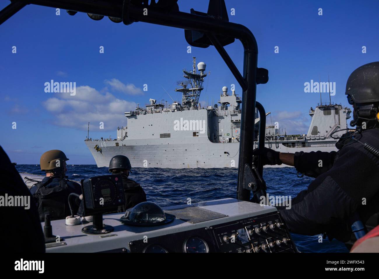 Sailors operate a 7-meter rigid inflatable boat during visit, board ...