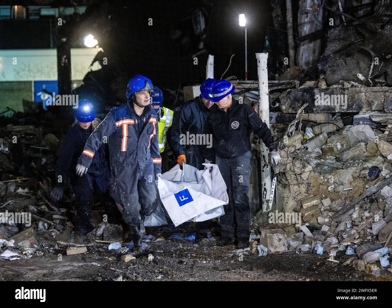 ROTTERDAM - Emergency services recover remains at the site where an ...