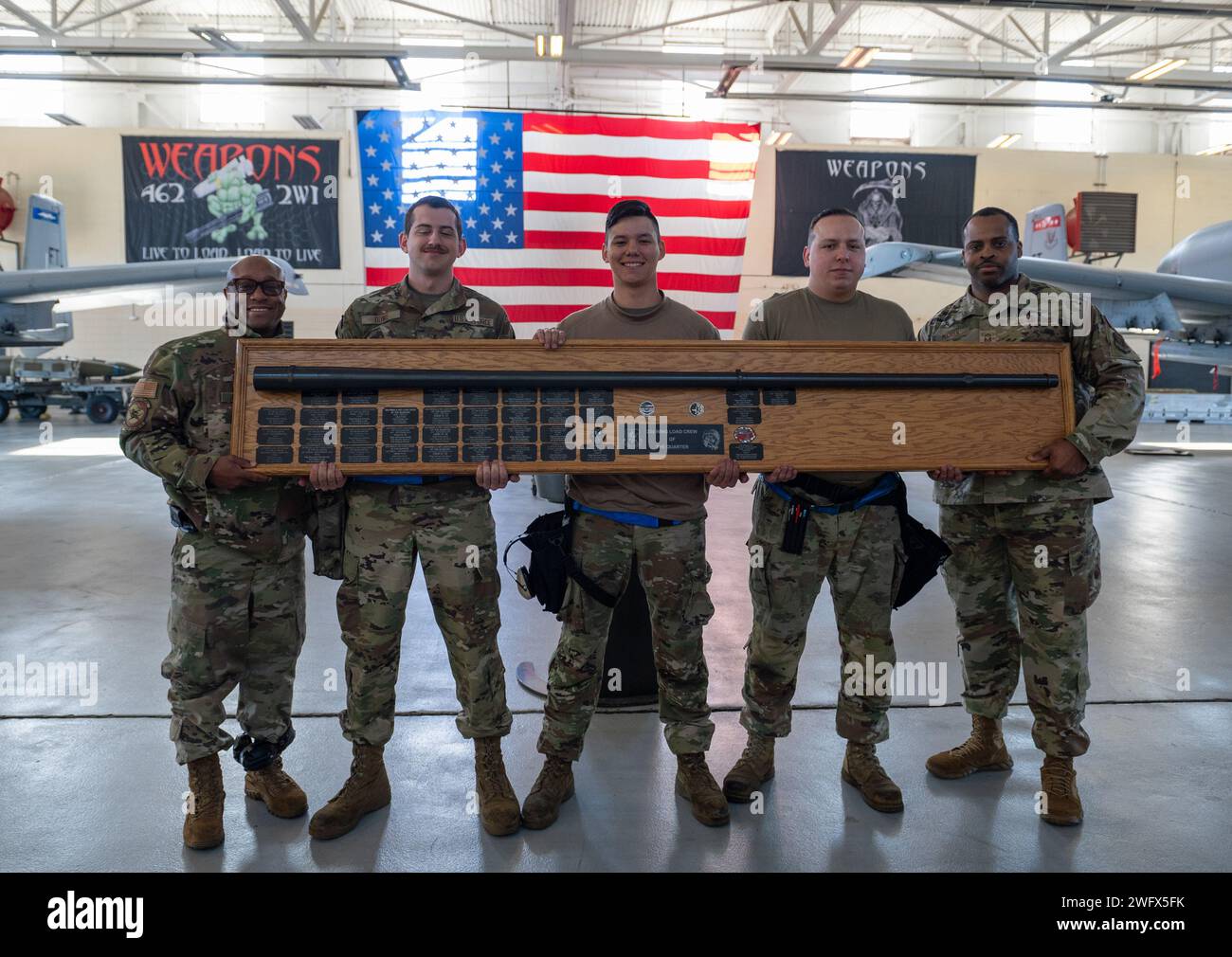 U.S. Air Force Airmen from the 74th Fighter Generation Squadron hold ...