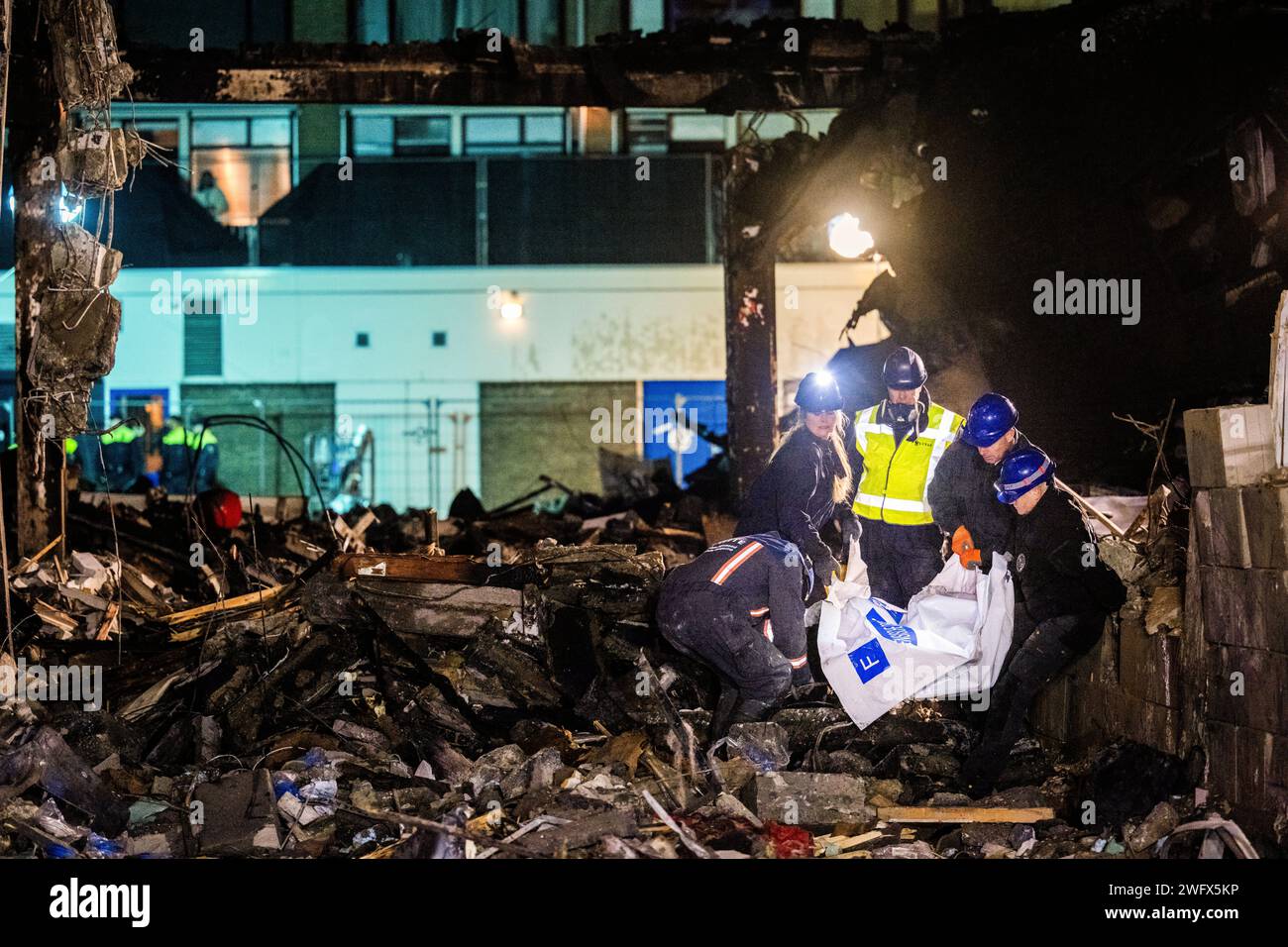 ROTTERDAM - Emergency services recover remains at the site where an ...