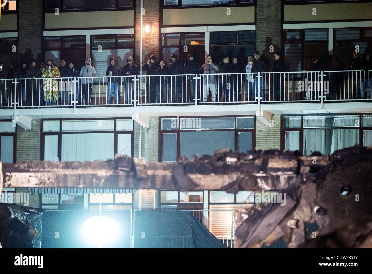 ROTTERDAM - Family watches as a body is recovered from a porch at the ...