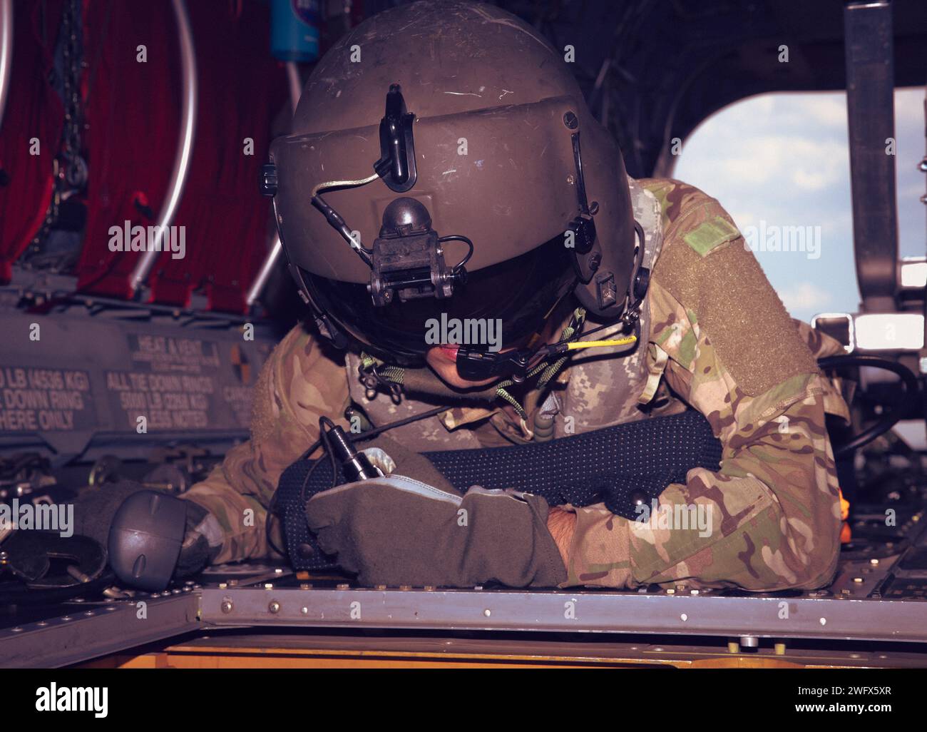 U.S. Army Cpl. Hank Watkins, a CH-47 Chinook crew chief with the 1 ...