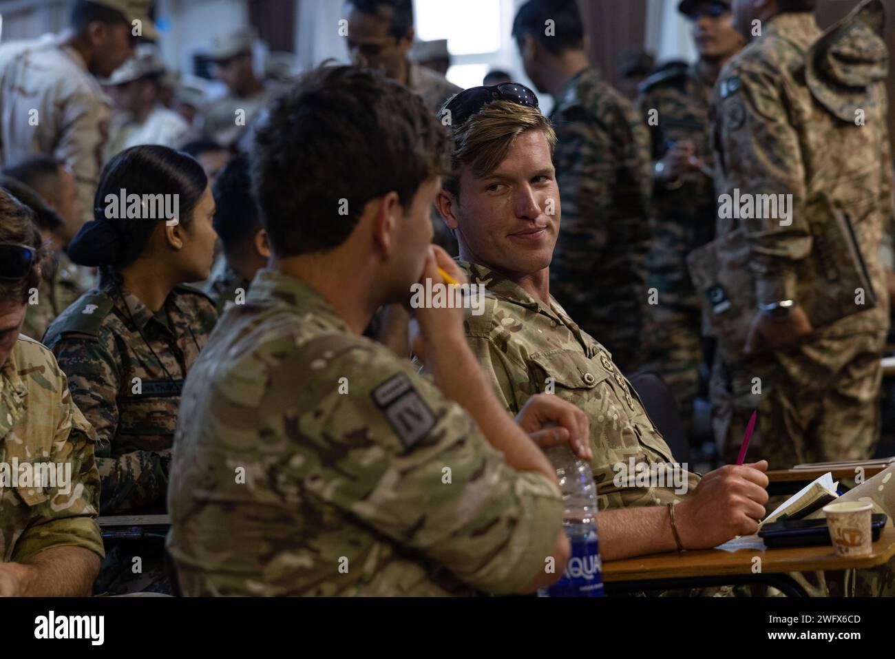 Partner nation armed forces attend an introduction brief at Mohamed ...