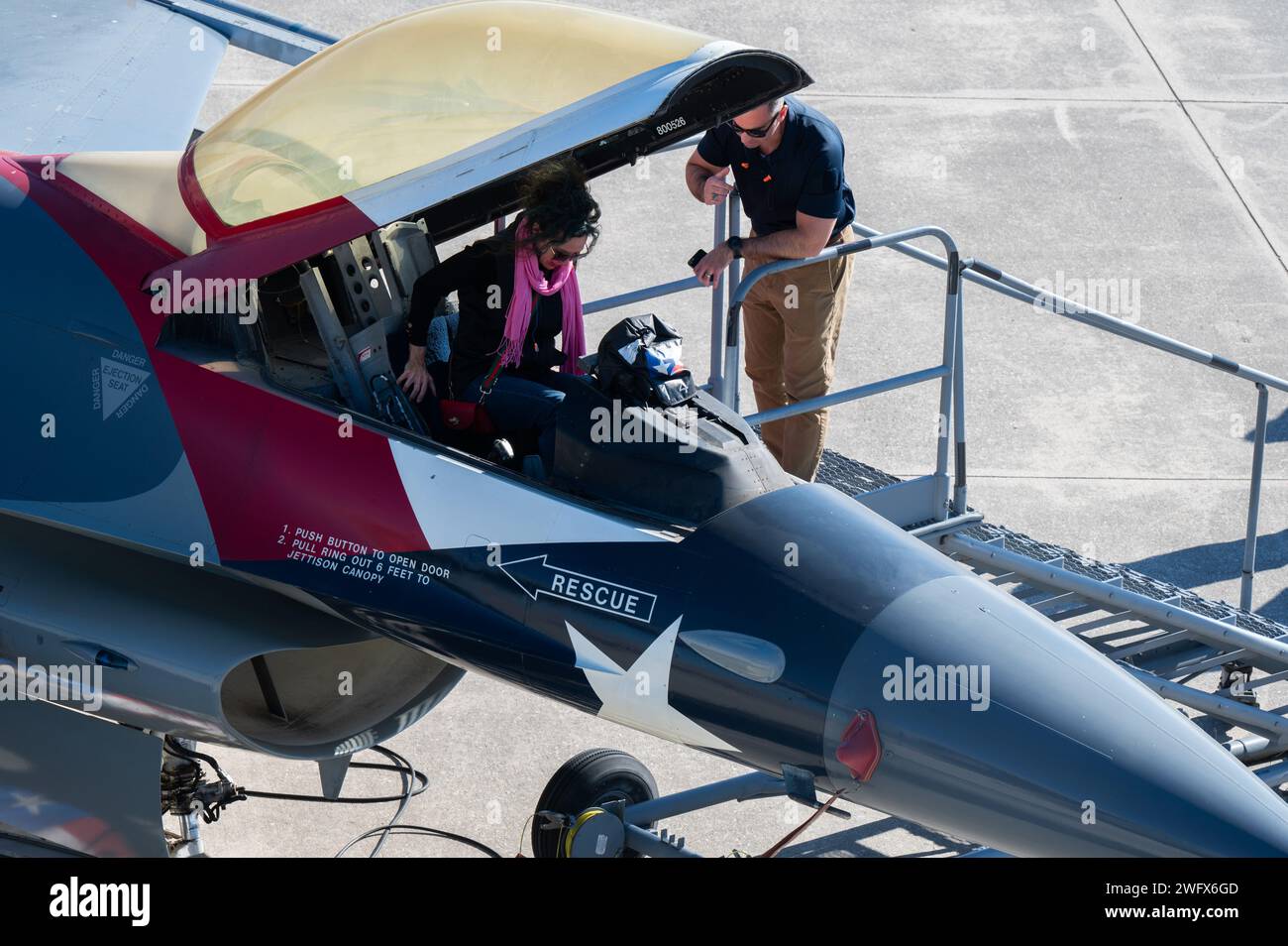 Andi Rodriguez, Leadership San Antonio member, sits inside an F-16 ...