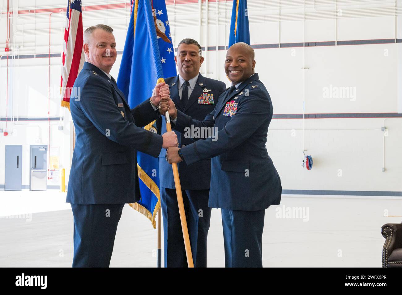 Maj. Gen. D. Scott Durham, 4th Air Force commander, passes the guidon ...