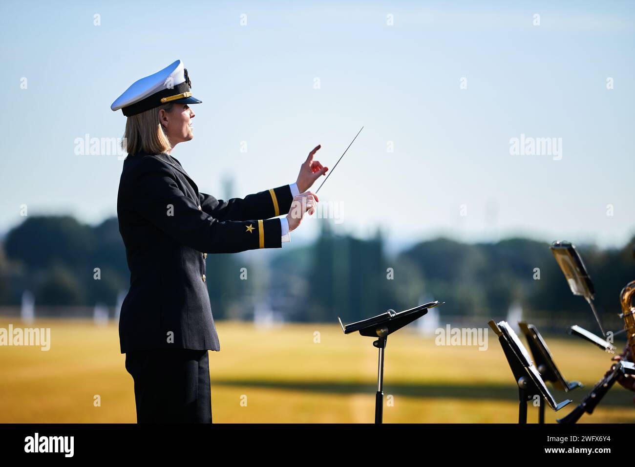 U.S. Navy Ensign Adele Demi, a ceremonial band conductor with the U.S ...