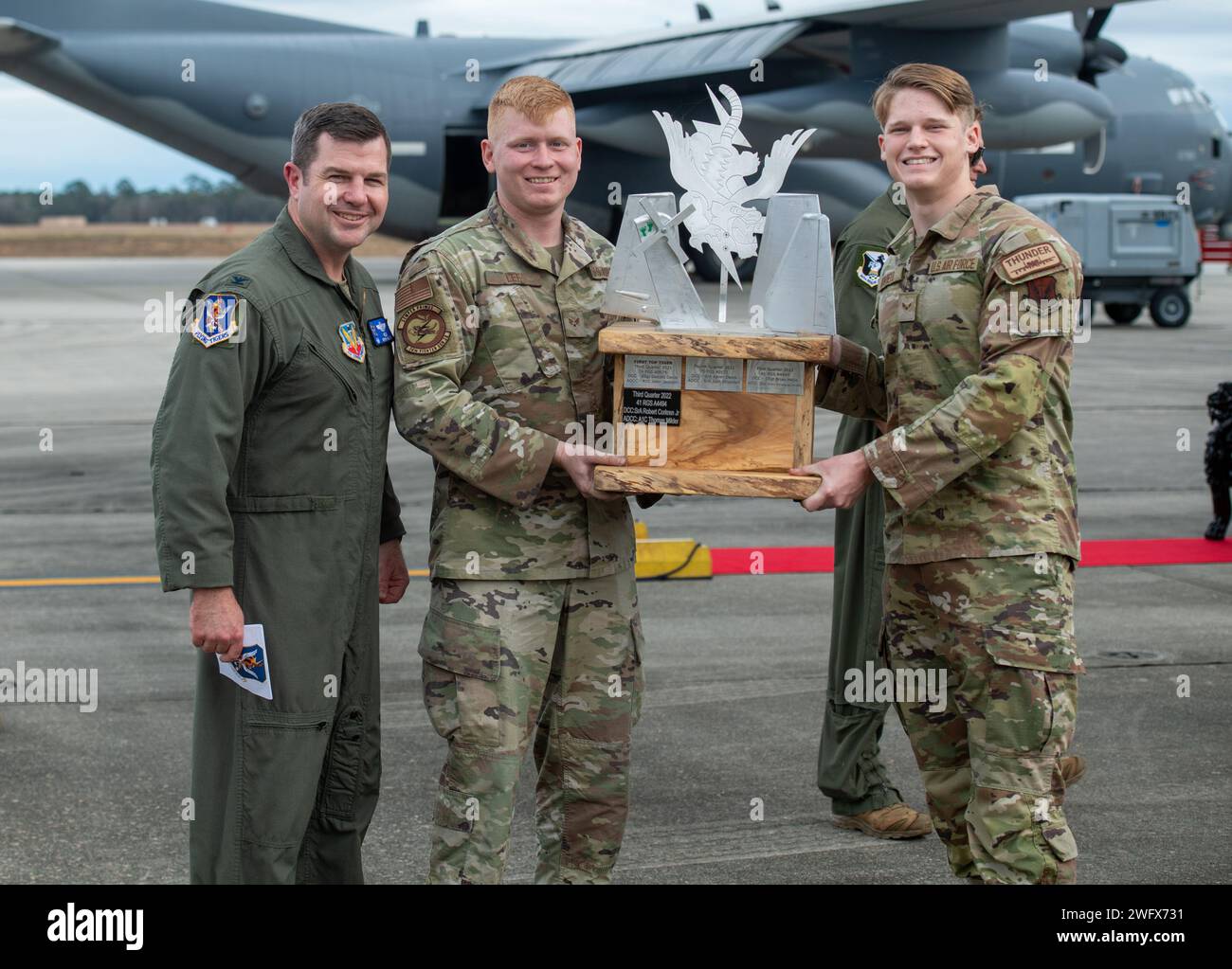 U.S. Air Force Col. Paul Sheets, 23rd Wing commander, (far left) stands ...