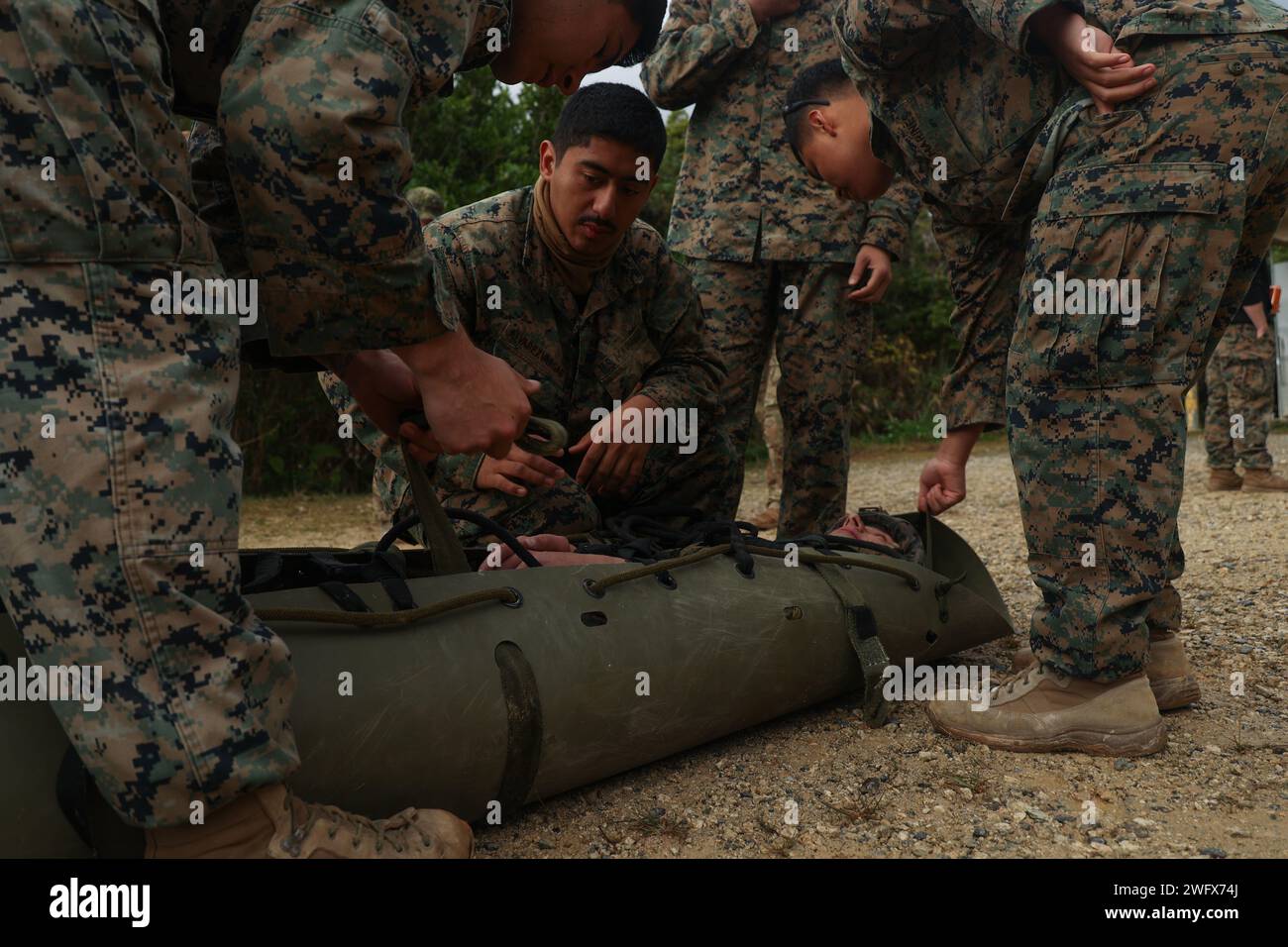 U.S. Marines with III Marine Expeditionary Force prepare a sked stretcher during Basic Jungle ...