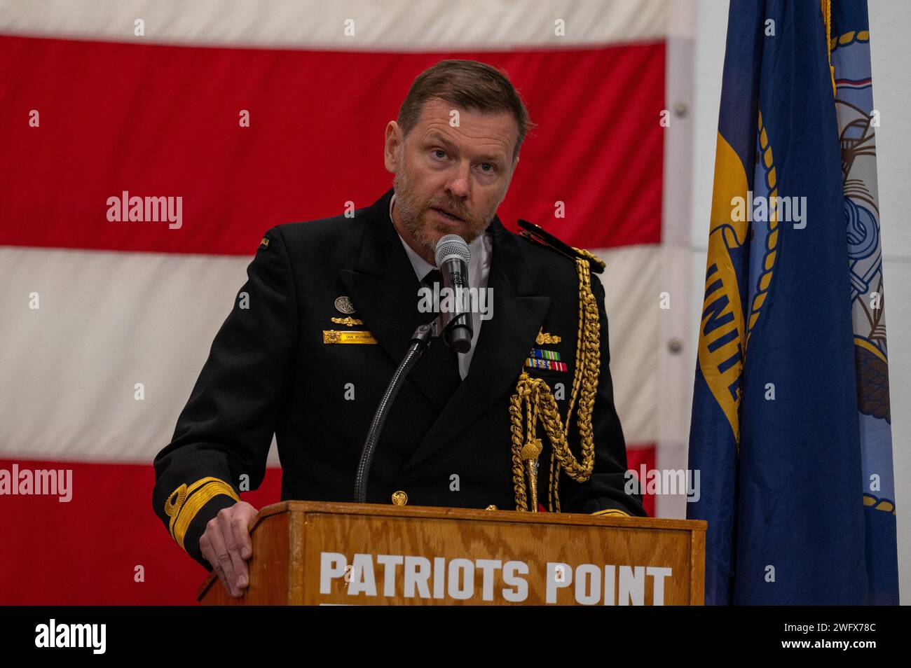 Royal Australian Navy Rear Admiral Ian Murray speaks to the audience of ...