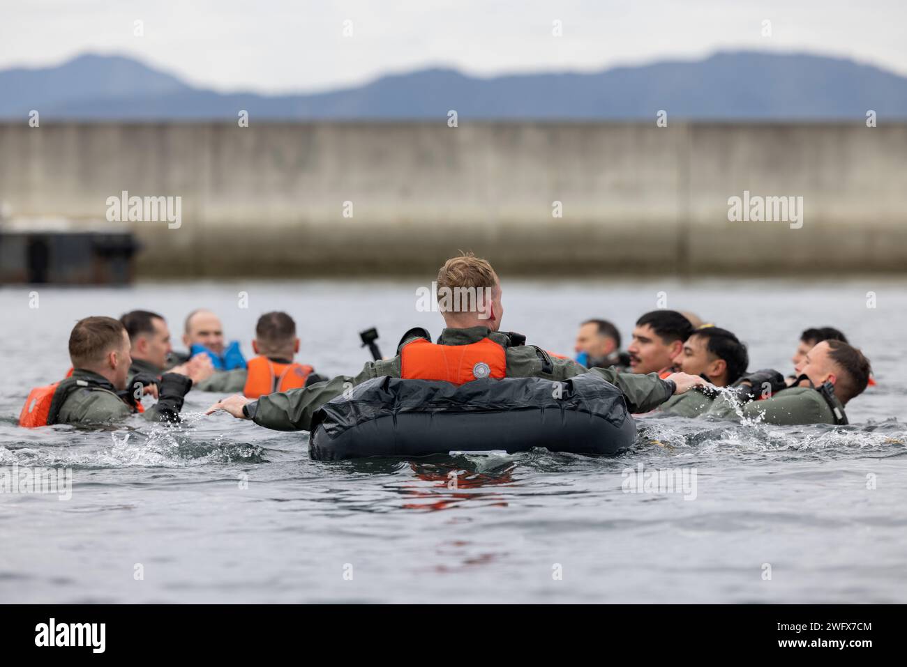 U.S. Marines with Marine Fighter Attack Squadron (VMFA) 242 participate in water survival ...
