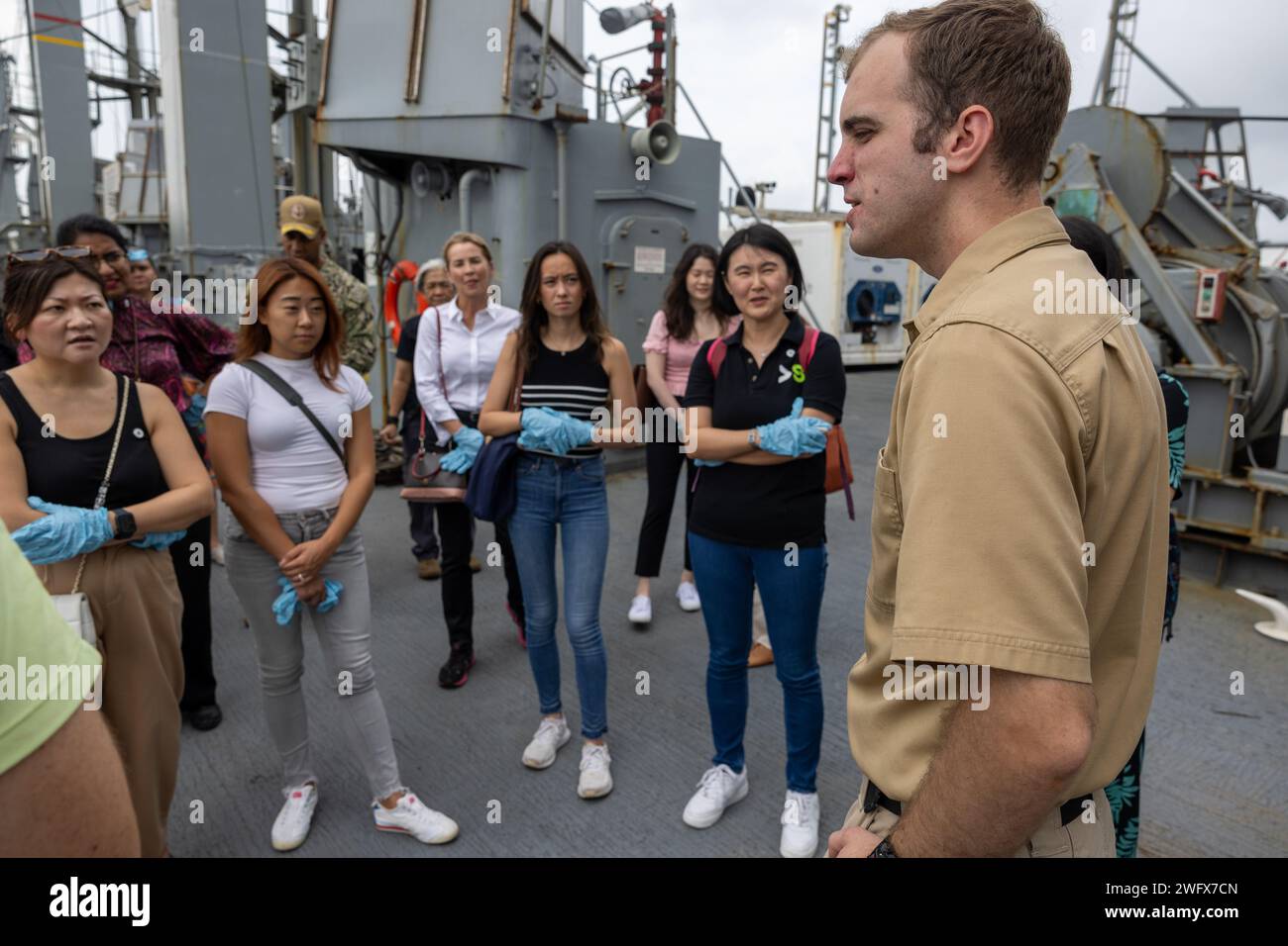 Civilian Mariner Scott Rebro, right, 3rd Mate, Military Sealift Command fleet replenishment ...