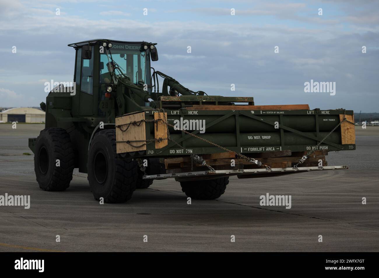 A U.S. Marine utilizes a Tractor, Rubber-Tired, Articulated Steering ...