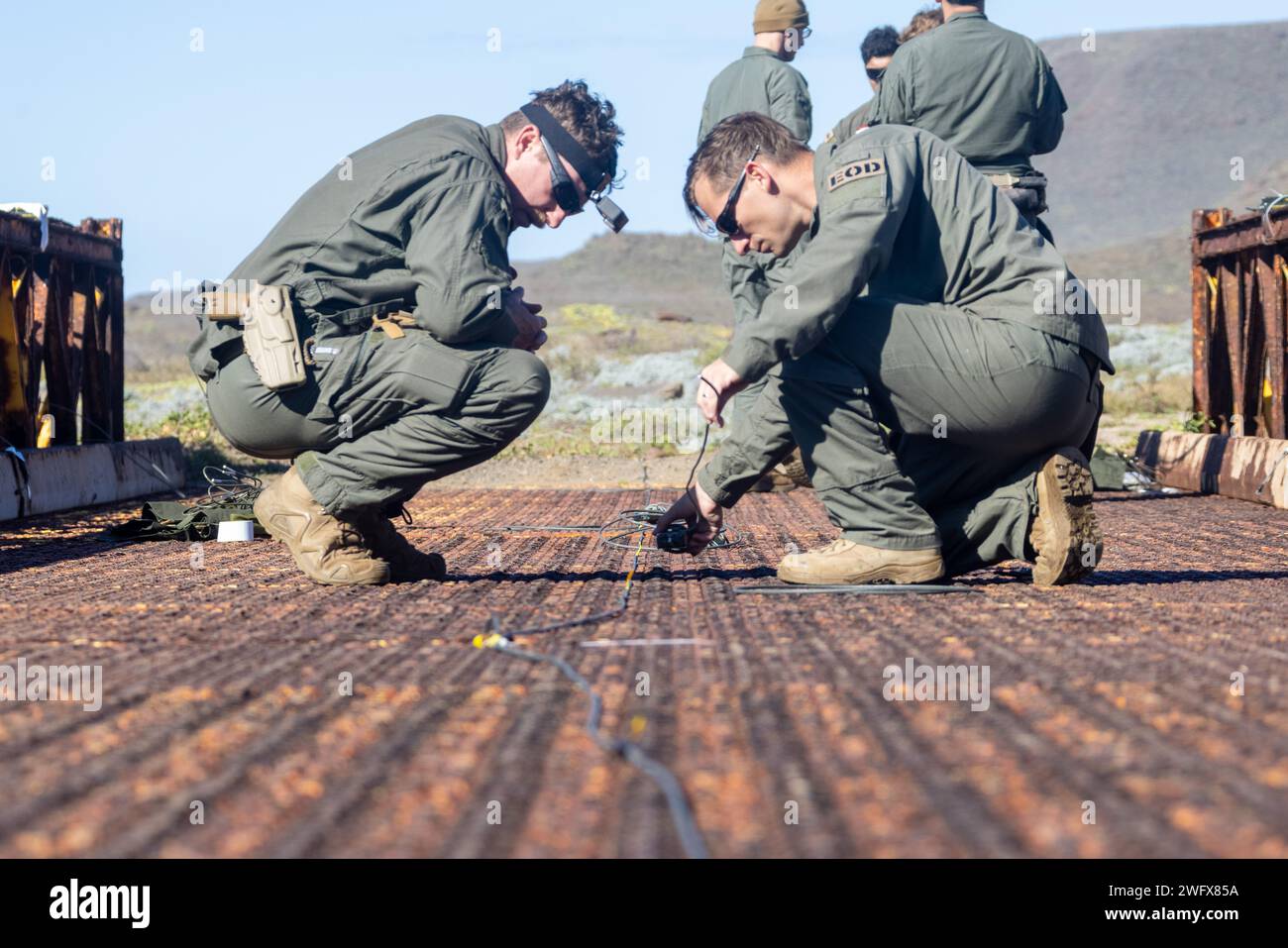 U.S. Marine Corps Staff Sgt. Christian Jones, left, an explosive ...