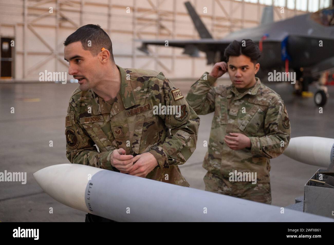 U.S. Air Force Staff Sgt. Trent Brodish (left), 18th Aircraft ...
