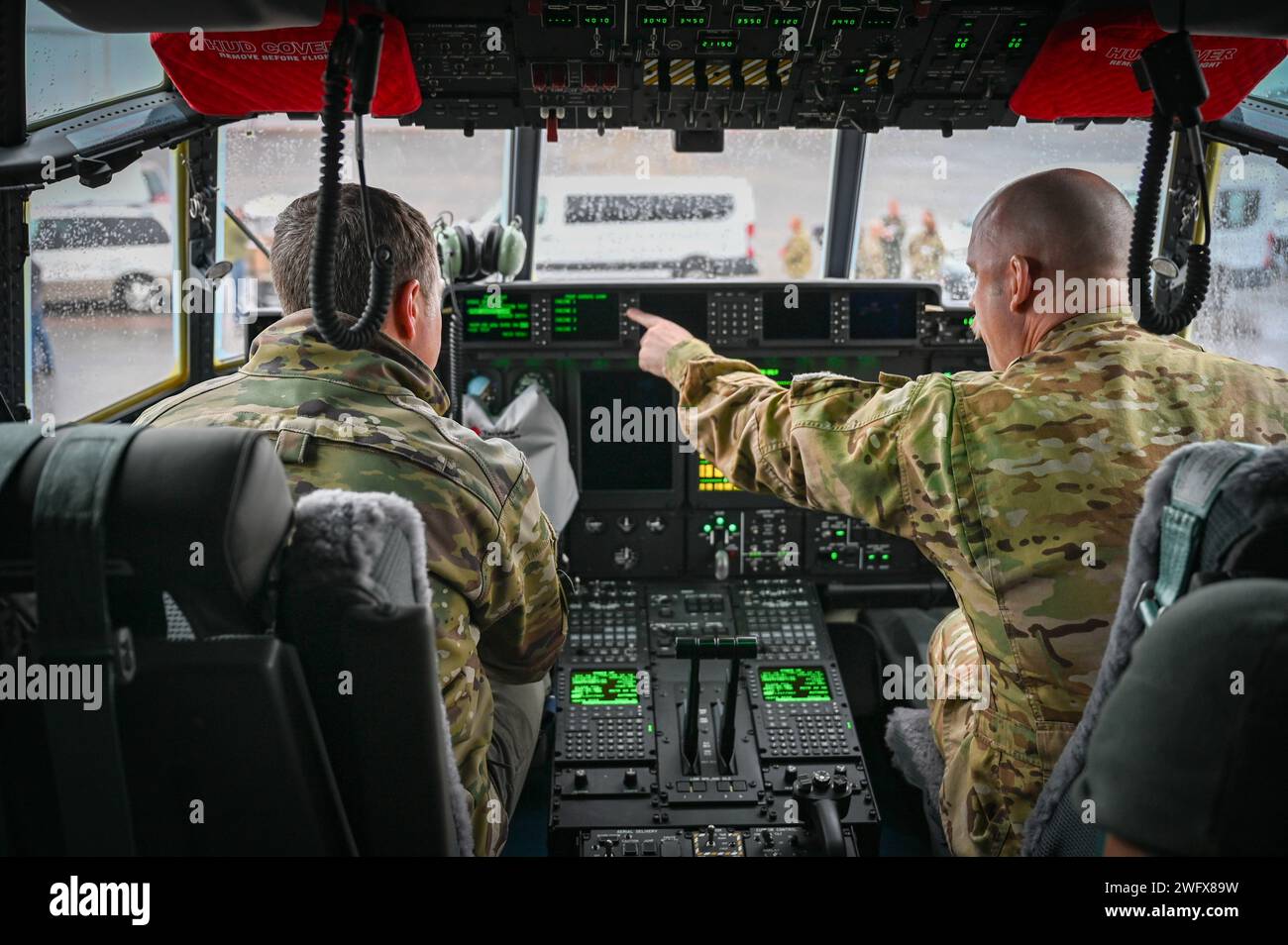 U.S. Air Force Maj. Steve Echuck, a C-130J pilot, and Master Sgt. Christopher Zeigler (right), a ...