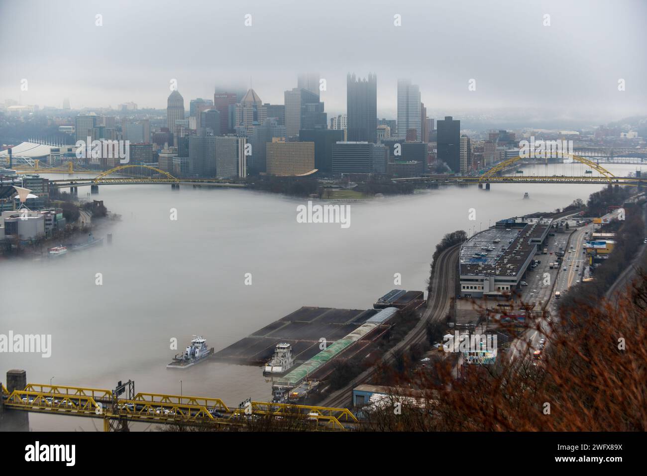 Towboats stage barges during foggy conditions on the Ohio River in ...