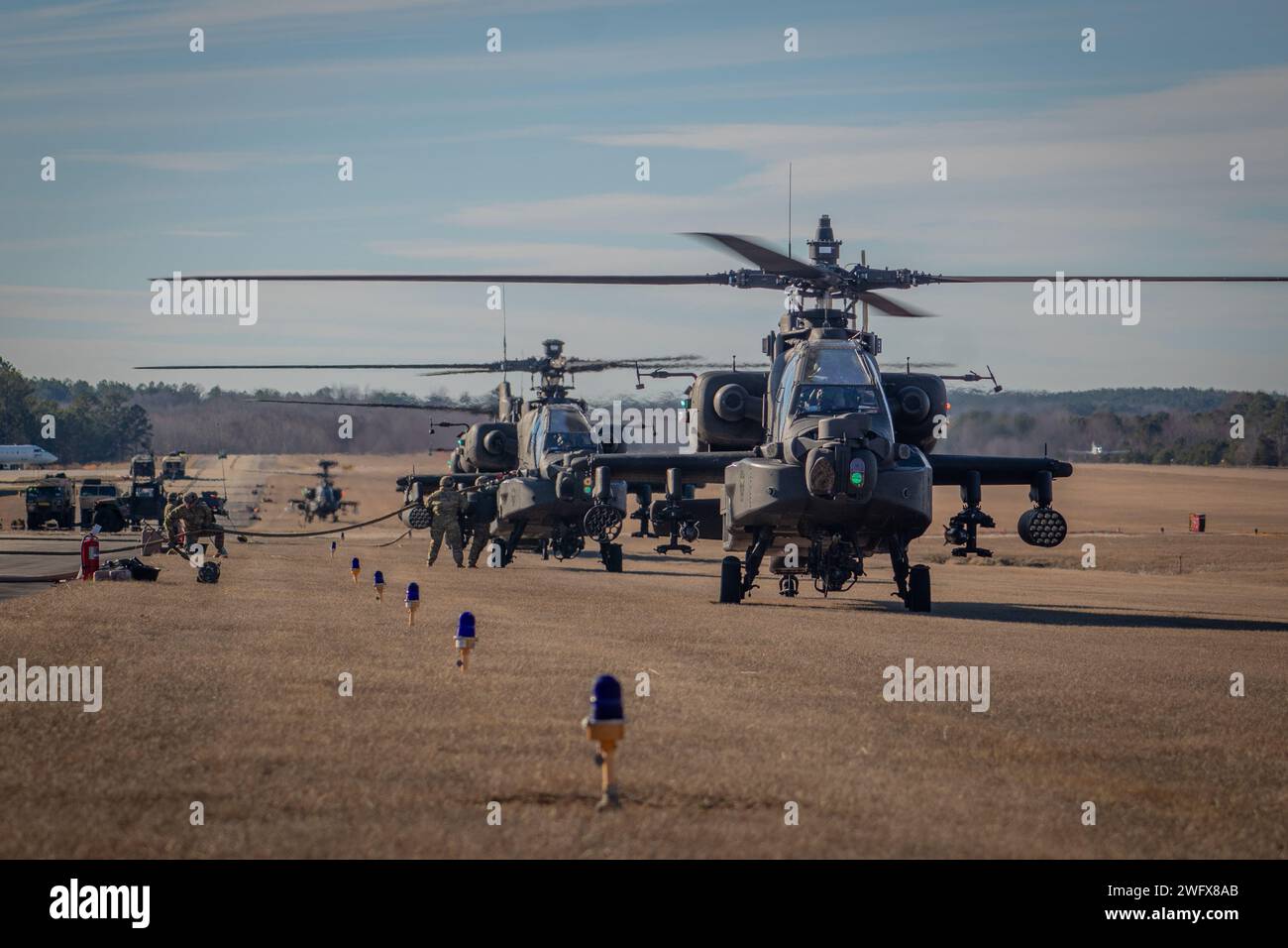AH-64E Apache helicopters are refueled at Oxford, MS during a Large ...