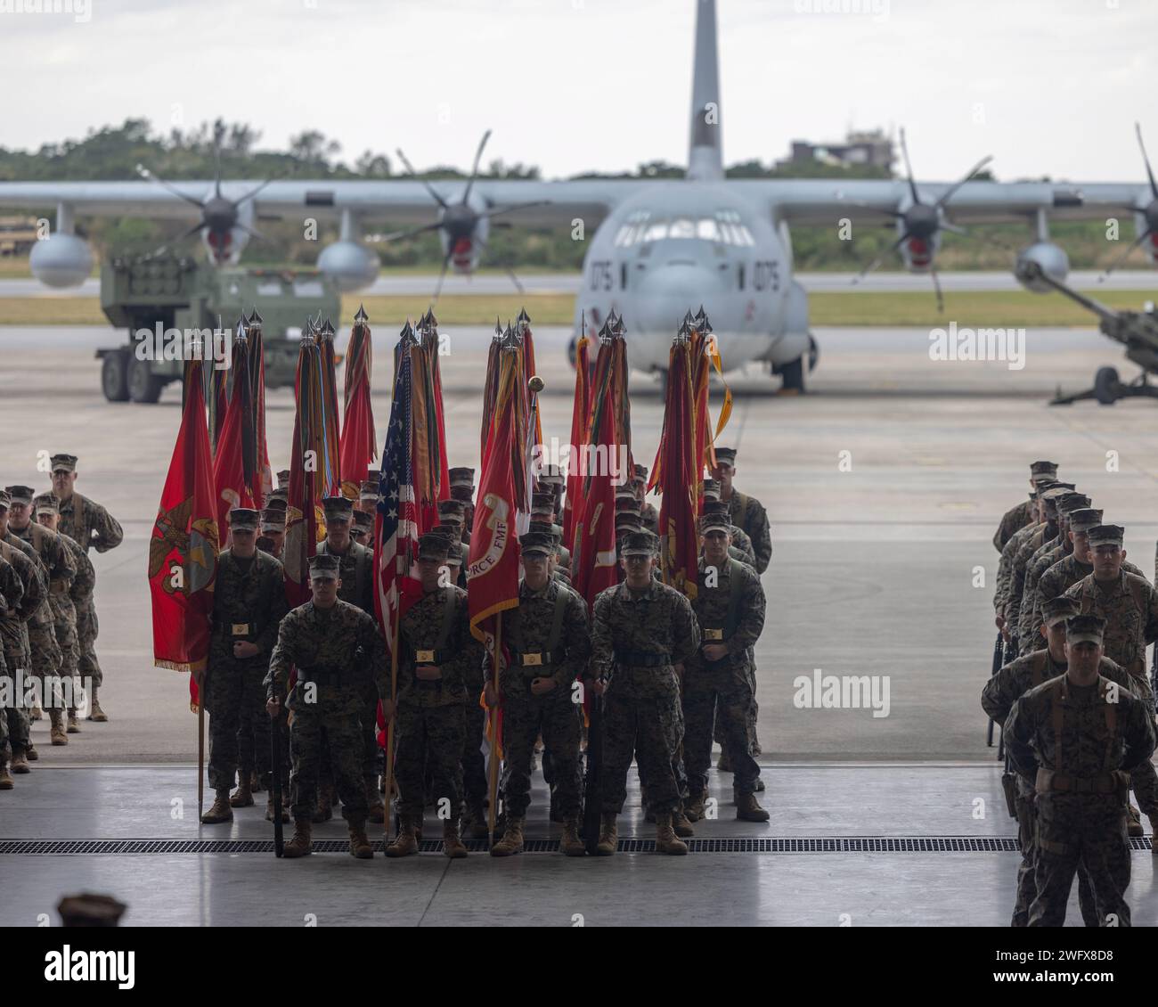 U.S. Marines with III Marine Expeditionary Force stand in formation ...