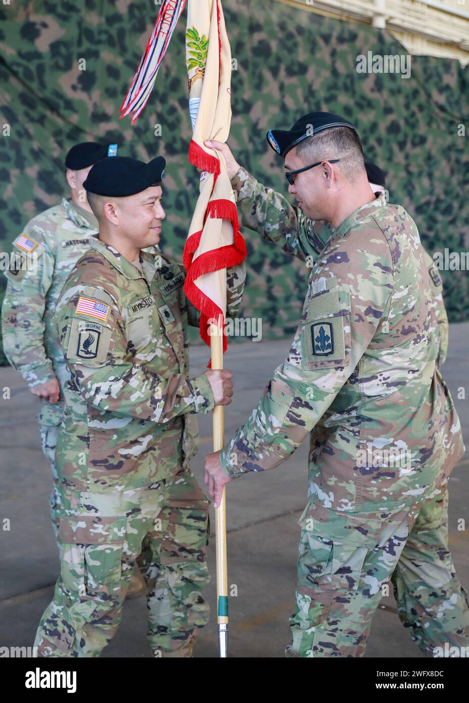 U.S. Army Lt. Col. Eric R. Miyasato Jr., left, outgoing commander of ...