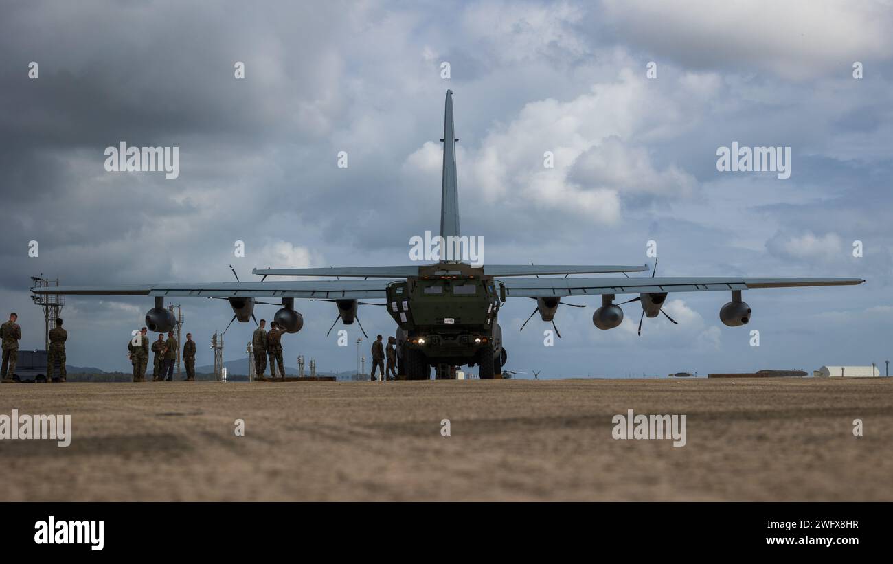 U.S. Marines prepare to load a High Mobility Artillery Rocket System ...