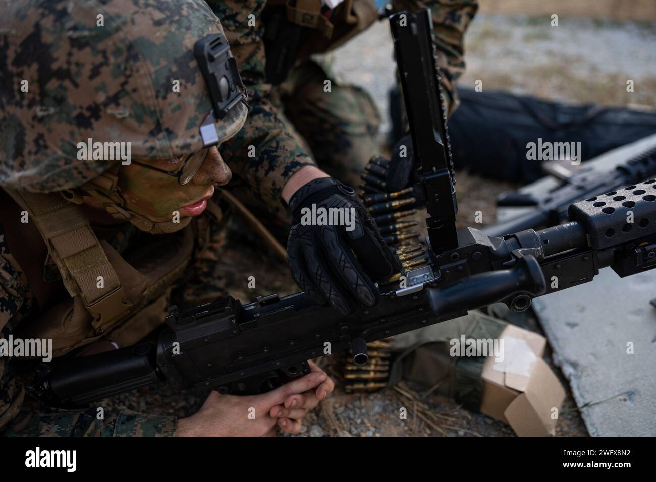 U.S. Marines with Marine Wing Headquarters Squadron (MWHS) 1 load an ...
