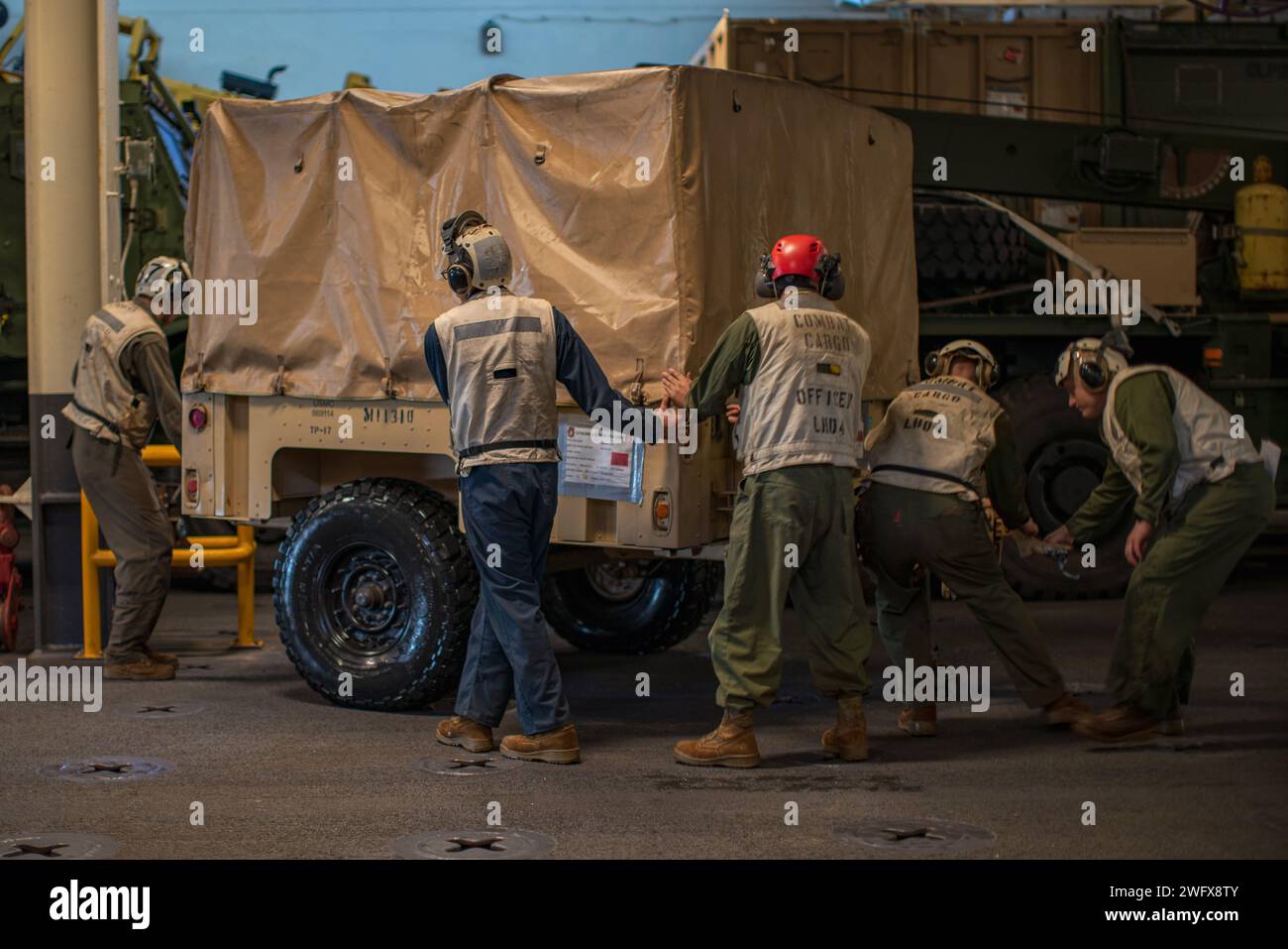 U.S. Marines assigned to the amphibious assault ship USS Boxer (LHD 4 ...