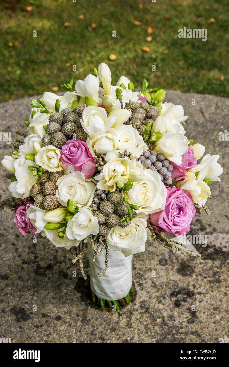 Wedding bouquet with freesia, rose and brunia flowers. Festive decor ...