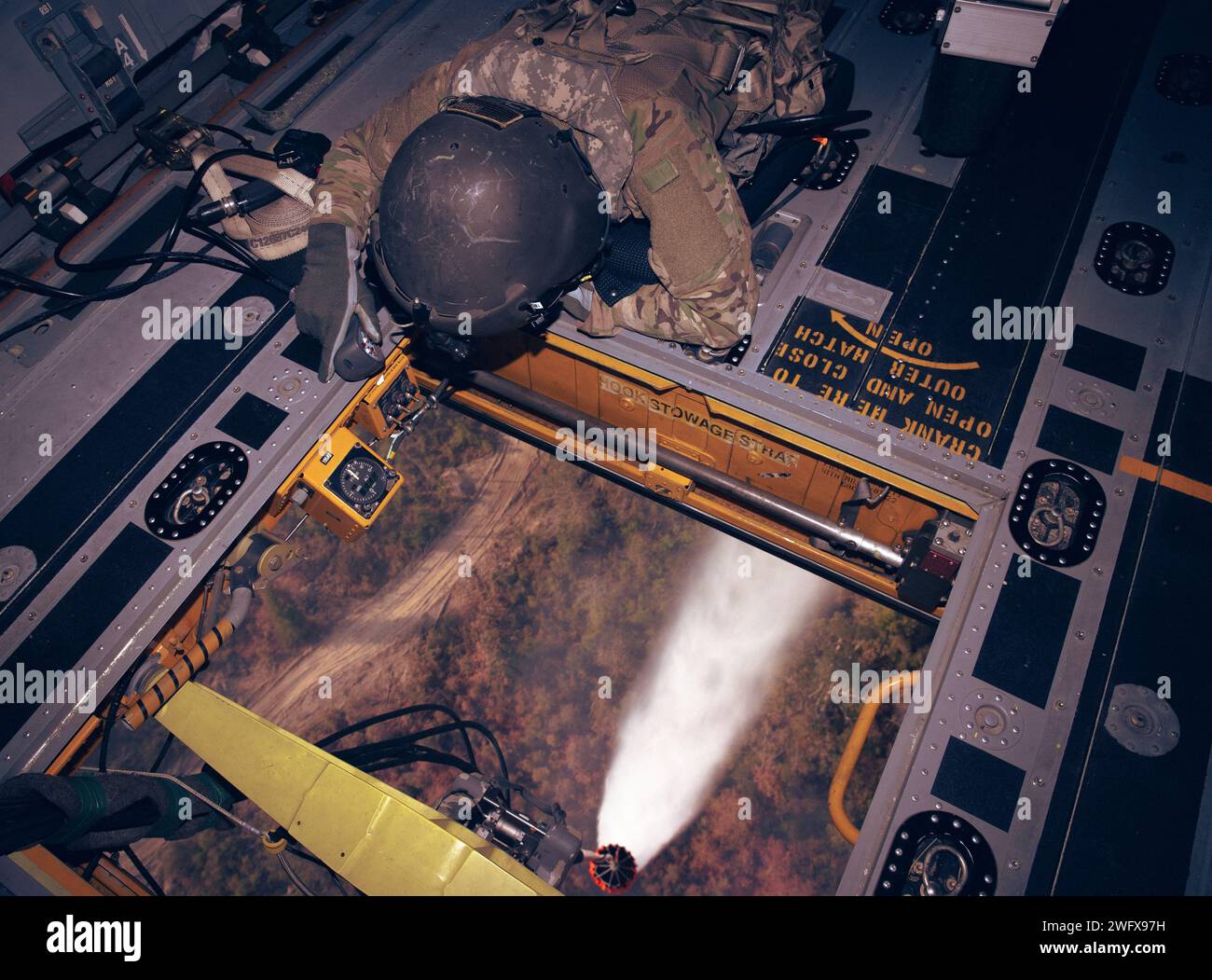 U.S. Army Cpl. Hank Watkins, a CH-47 Chinook crew chief with the 1 ...