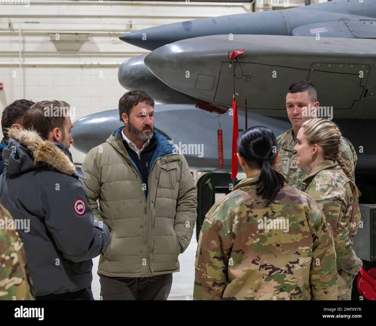 Members of the 5th Maintenance Group speak to Mr. Paul Dean, Department of State Principal ...
