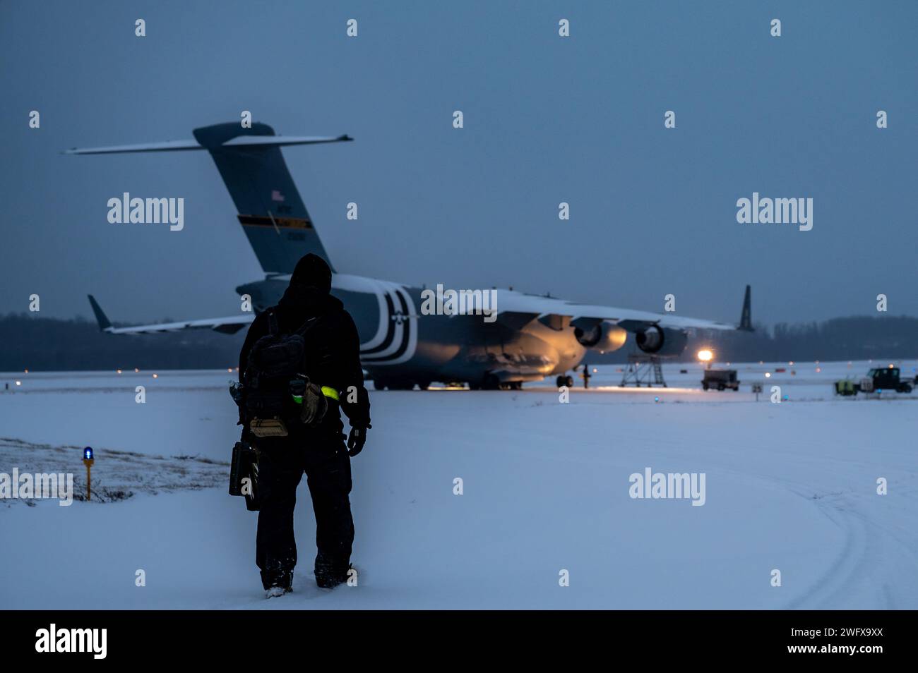 A crew chief assigned to the 911th Aircraft Maintenance Squadron, walks ...