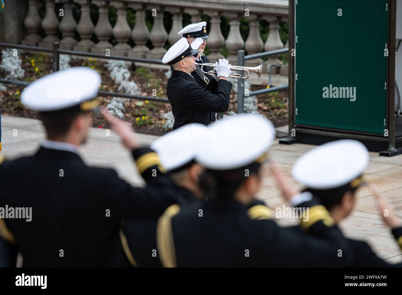 A trumpeter from the U.S. Navy Ceremonial Band plays Taps during a Navy ...