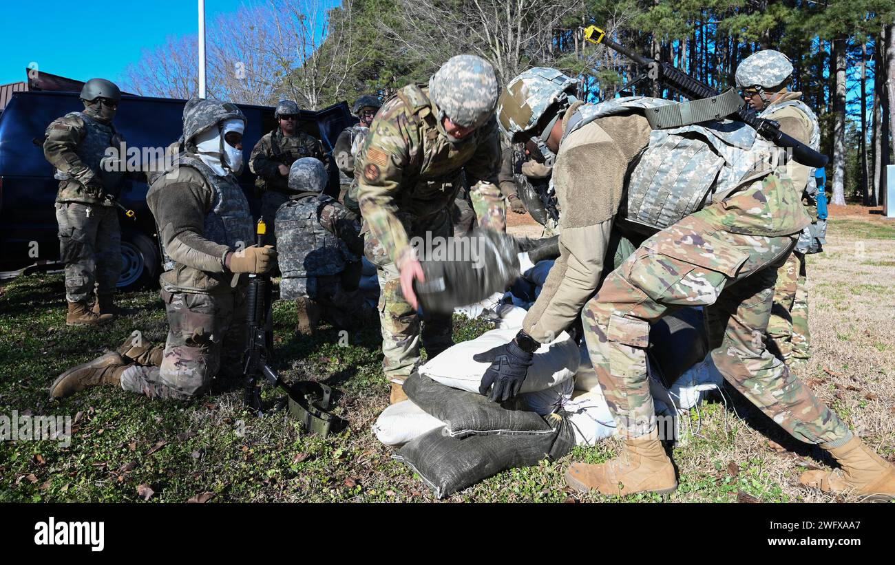 U.S. Airmen assigned to the 4th Civil Engineer Squadron build a defense ...