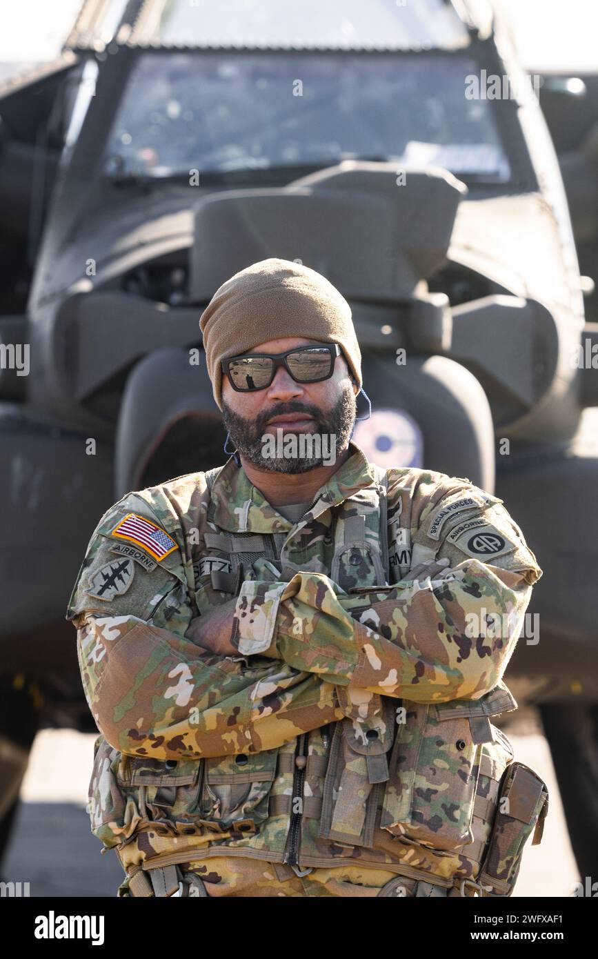 U.S. Army Warrant Officer Stewart Setzer, an AH-64E Apache Pilot, poses ...