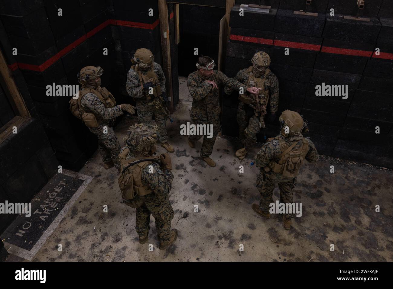U.S. Marine Corps Gunnery Sgt. Travis Maine, center, a ground ...