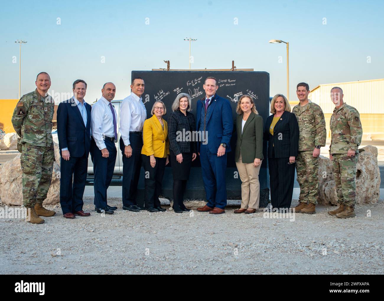 Members of Congress pose with leadership of an Air Expeditionary Wing ...