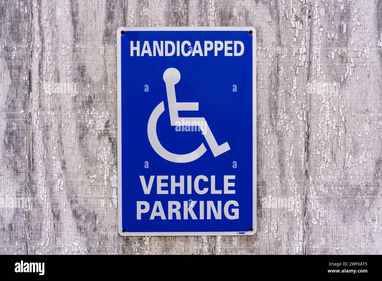 Blue sign reading Handicapped Vehicle Parking with iconic wheelchair ...